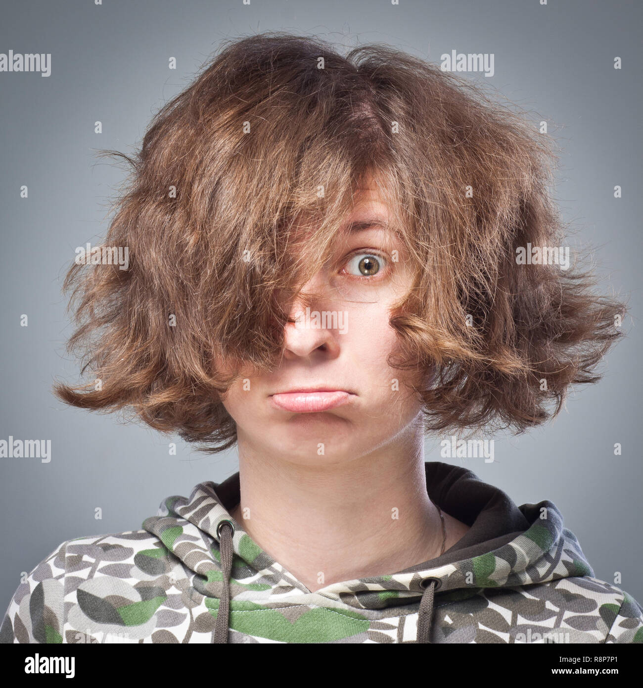 portrait of a girl with disheveled hair, surprise, emotions cool in ...