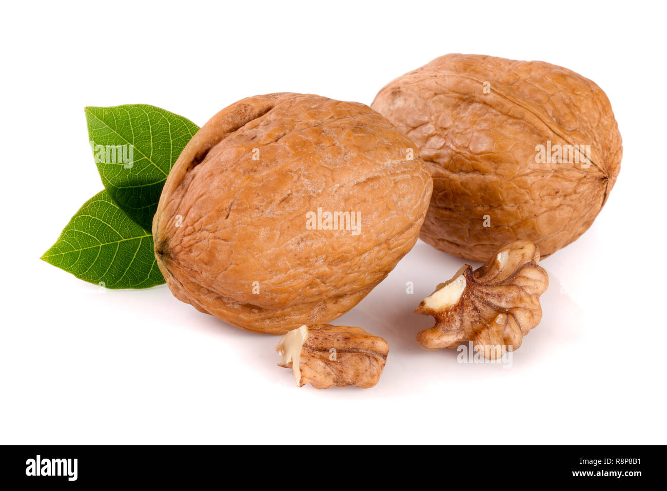 Walnuts with leaf isolated on white background Stock Photo - Alamy