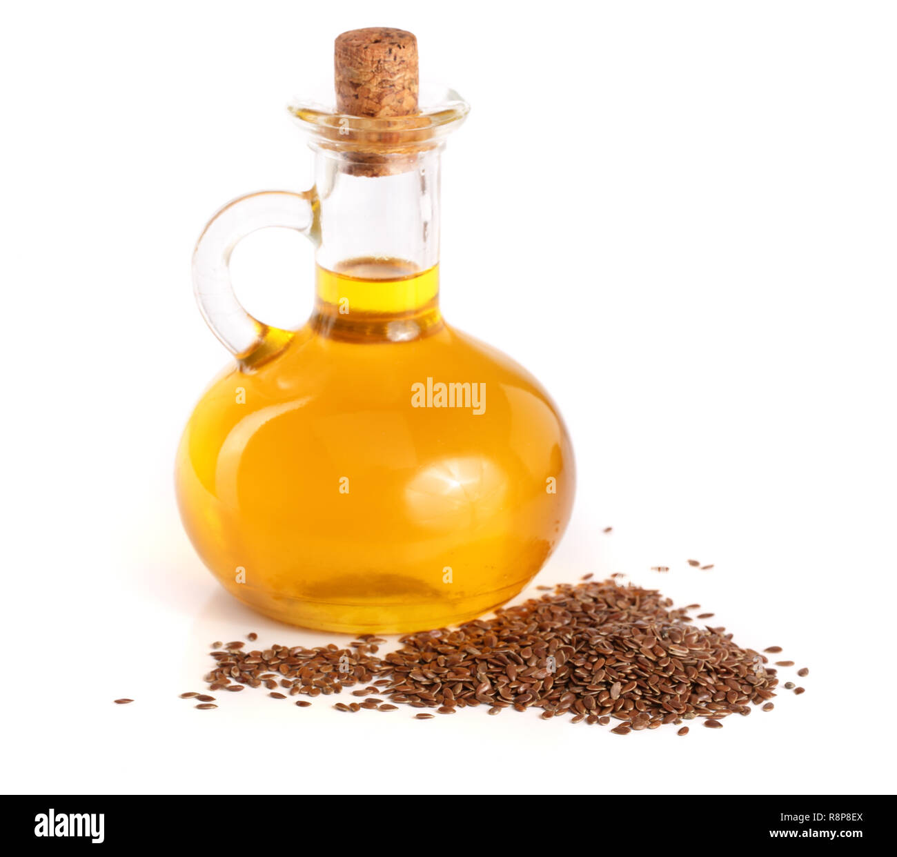 linseed oil with flax seeds isolated on white background Stock Photo ...