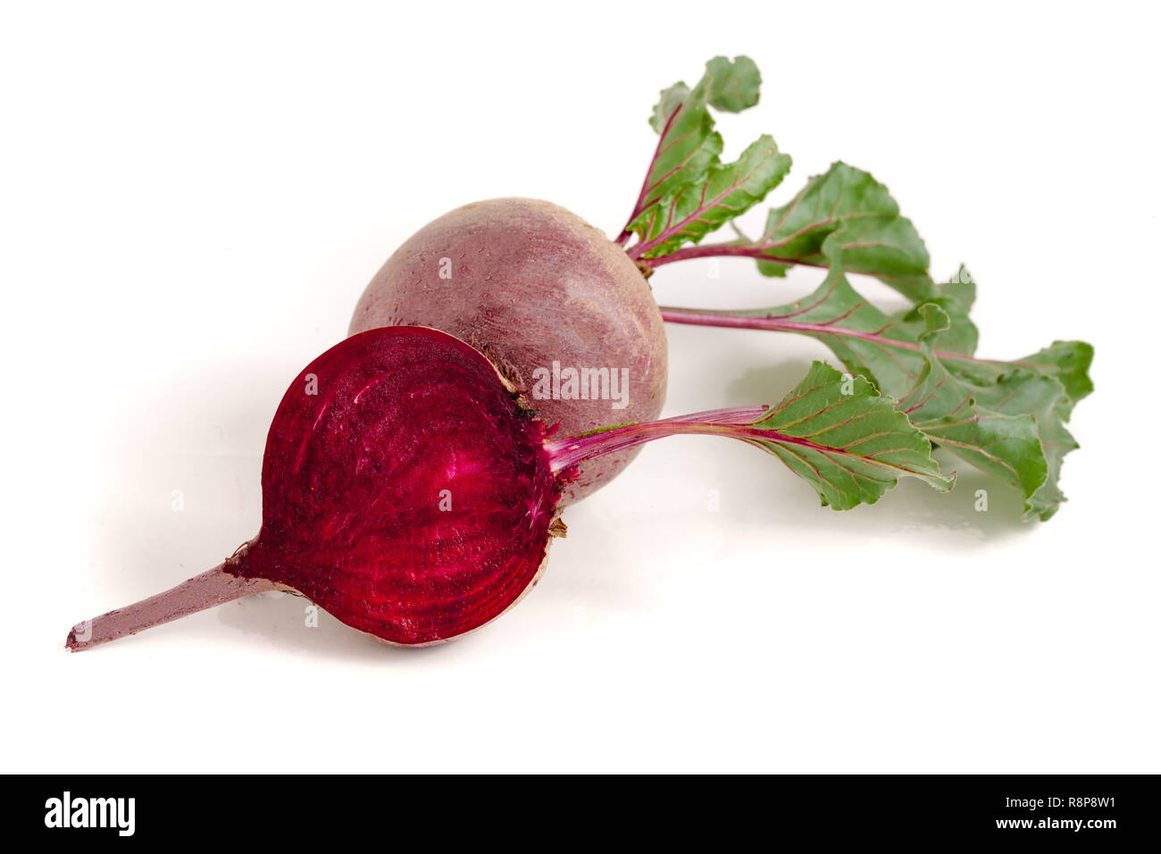 beetroot and half with leaf isolated on white background Stock Photo ...