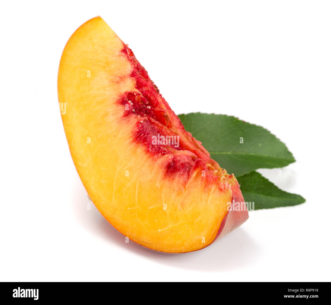 slice of peach with green leaf isolated on white background Stock Photo ...