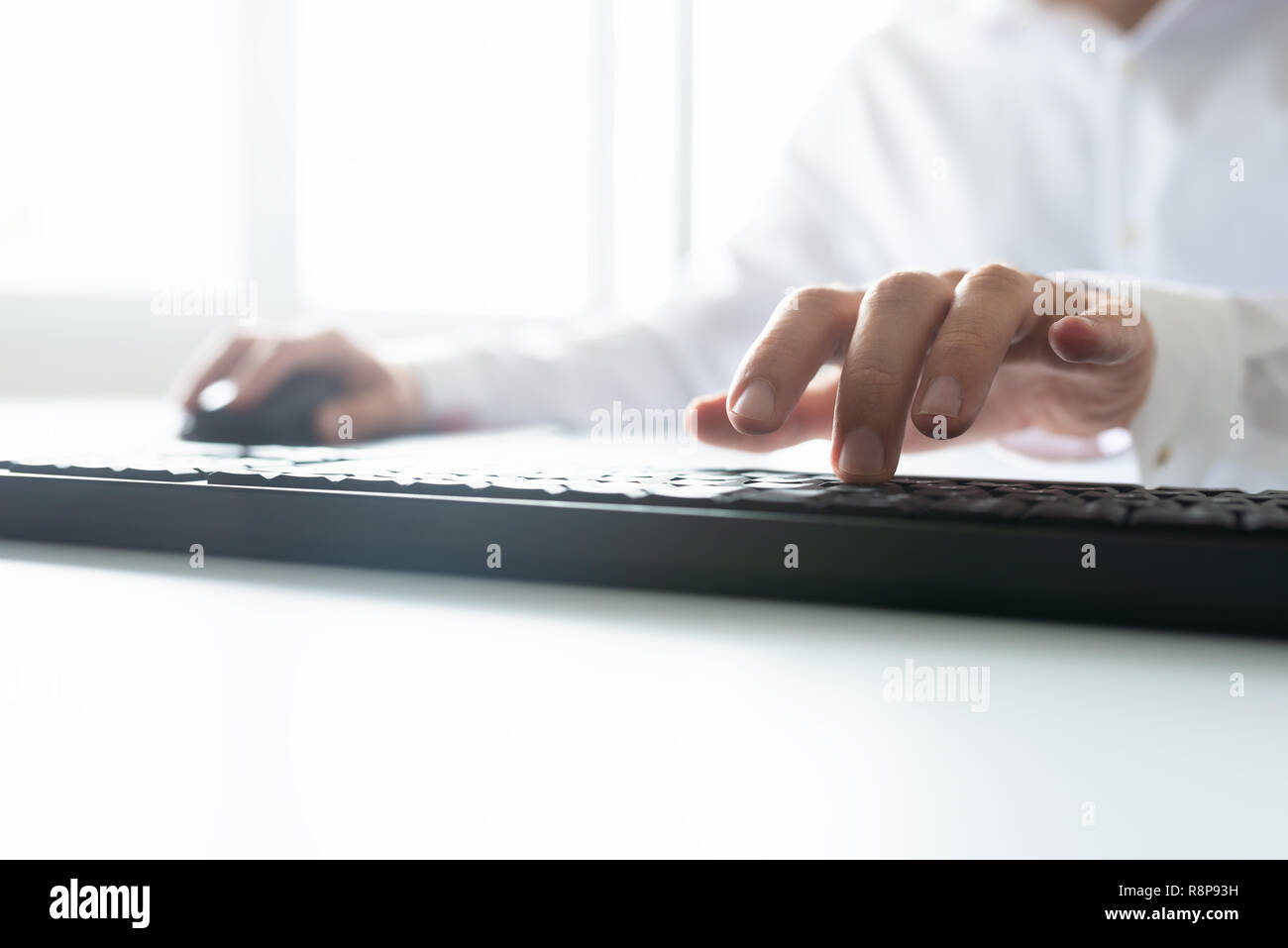 Low angle view of business programmer working in office using black ...