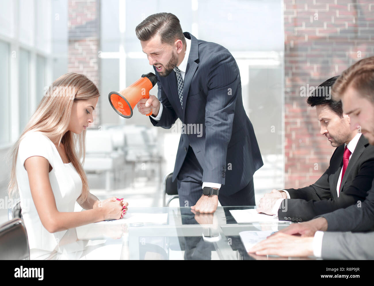 businessman yelling at a female employee through a megaphone Stock ...