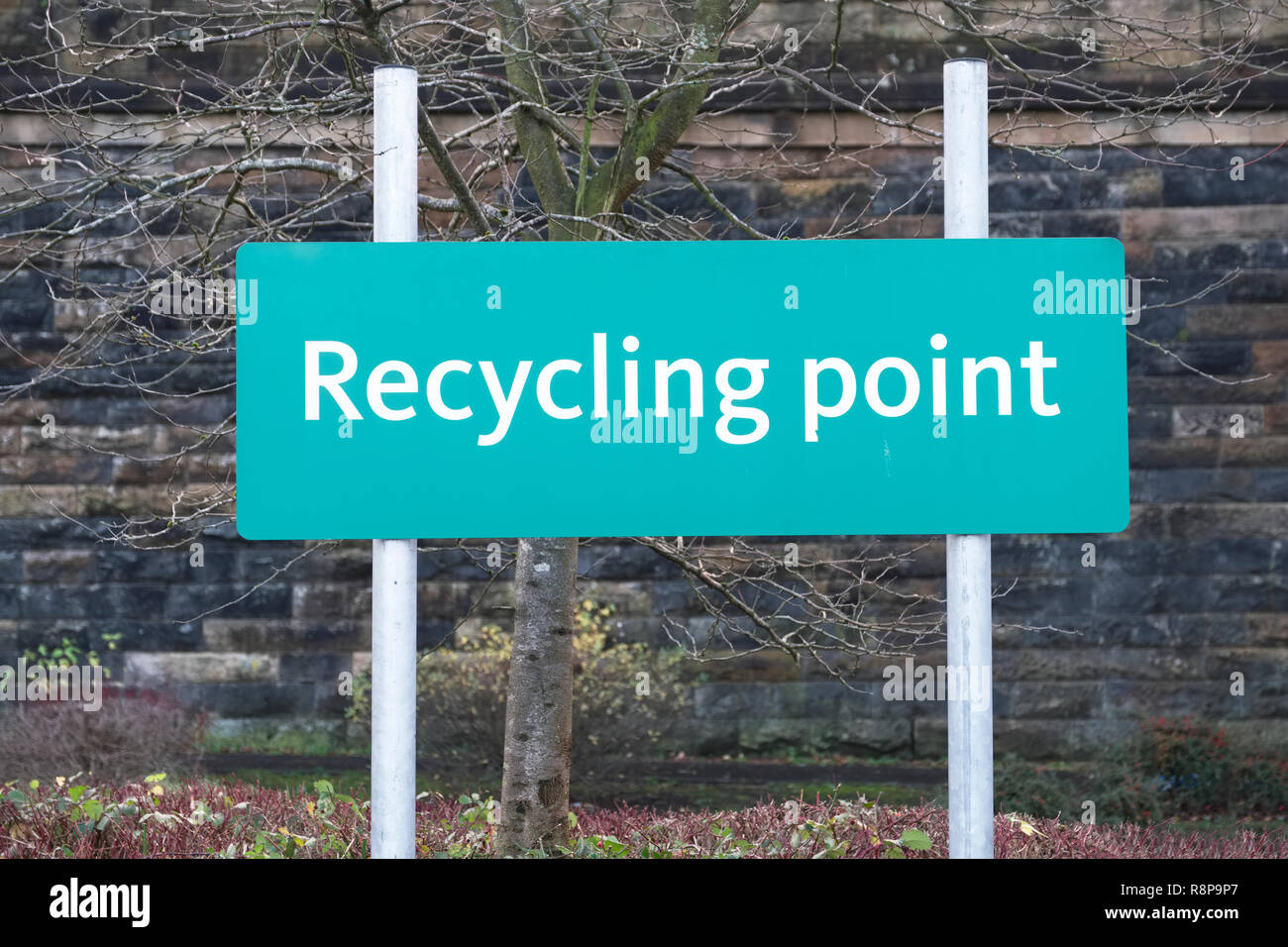 Recycling point sign at skip bin rubbish Stock Photo - Alamy