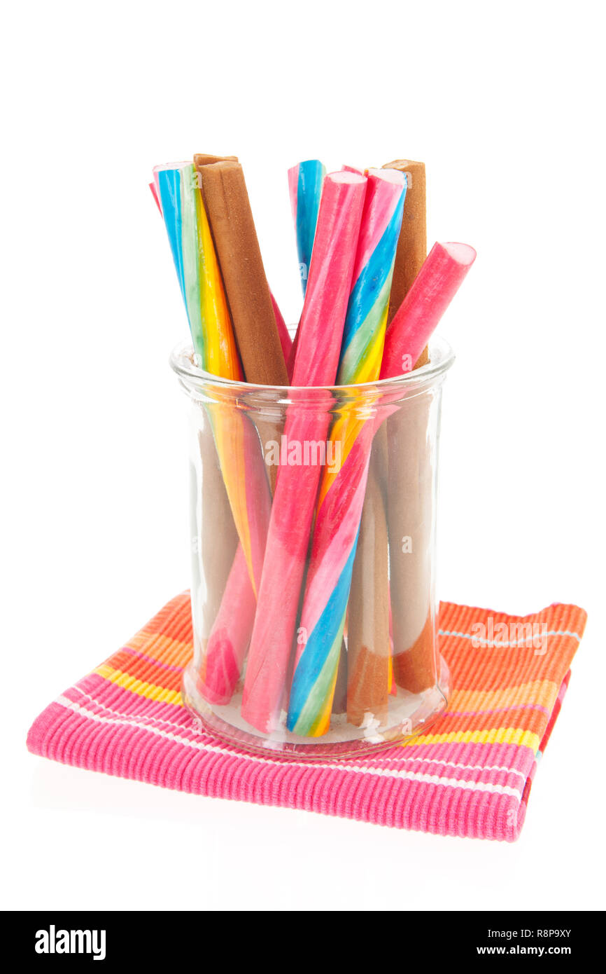 Colorful candy canes in different tastes isolated over white background ...