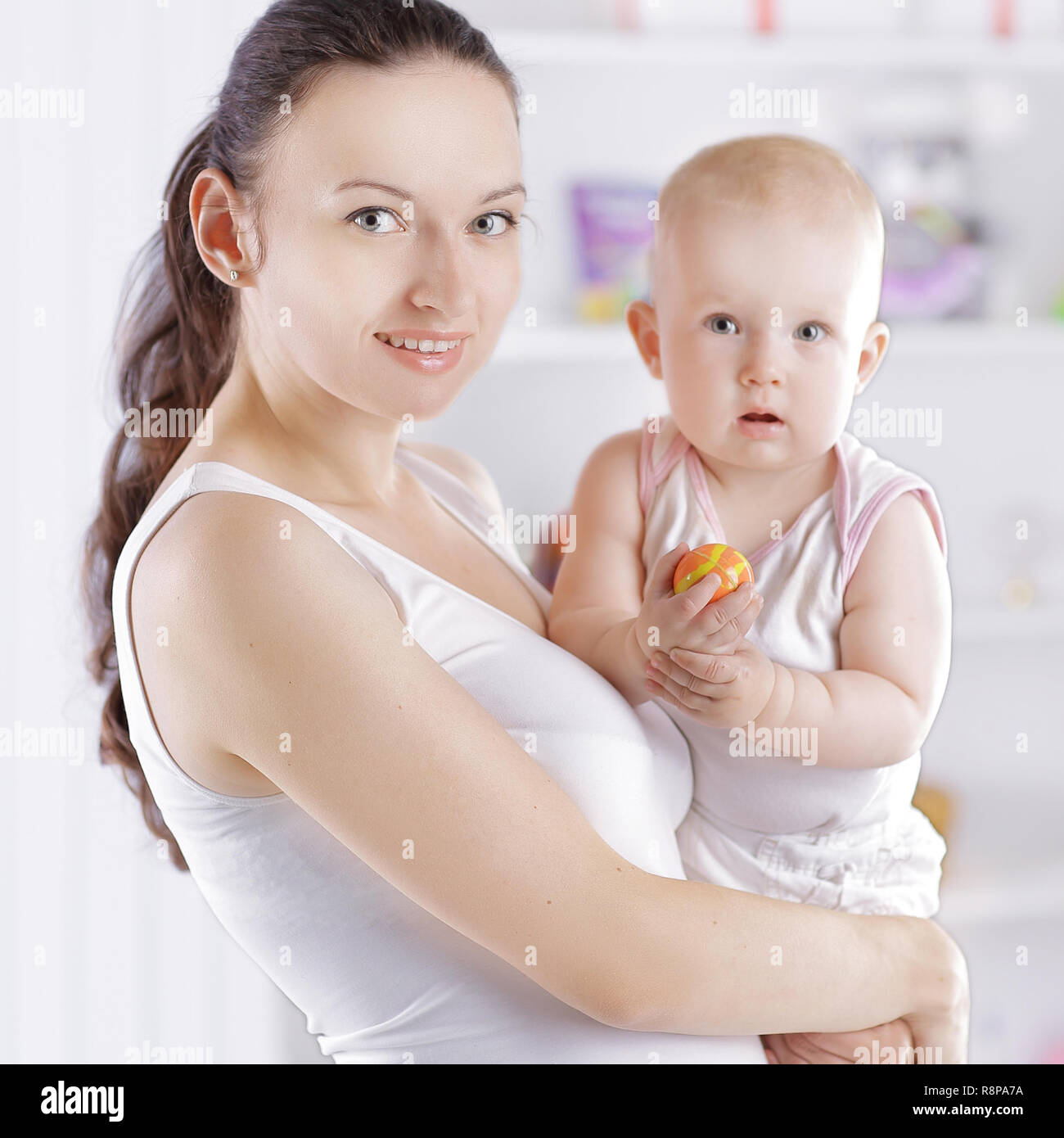 modern young mother with a charming baby Stock Photo - Alamy modern young mother with a charming baby Stock Photo - Alamy