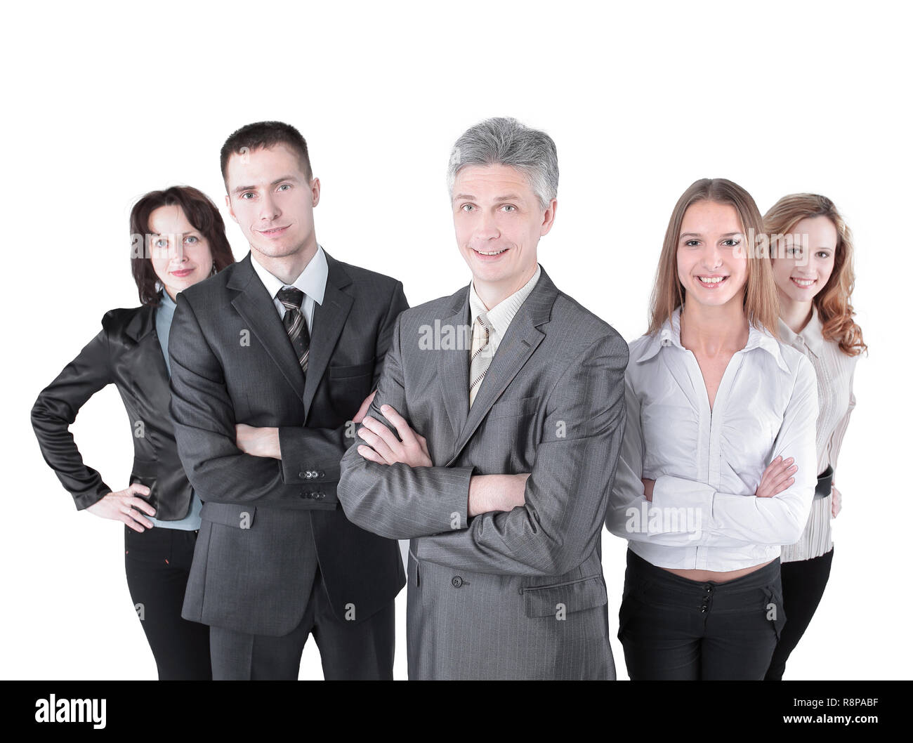 Team leader stands with coworkers in background Stock Photo - Alamy