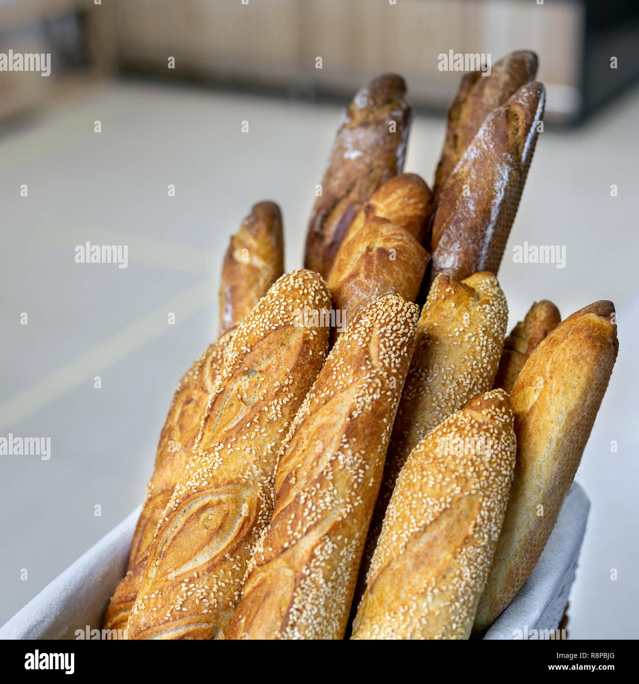 Traditional crusty French bread baguette in basket at bakery. Fresh ...