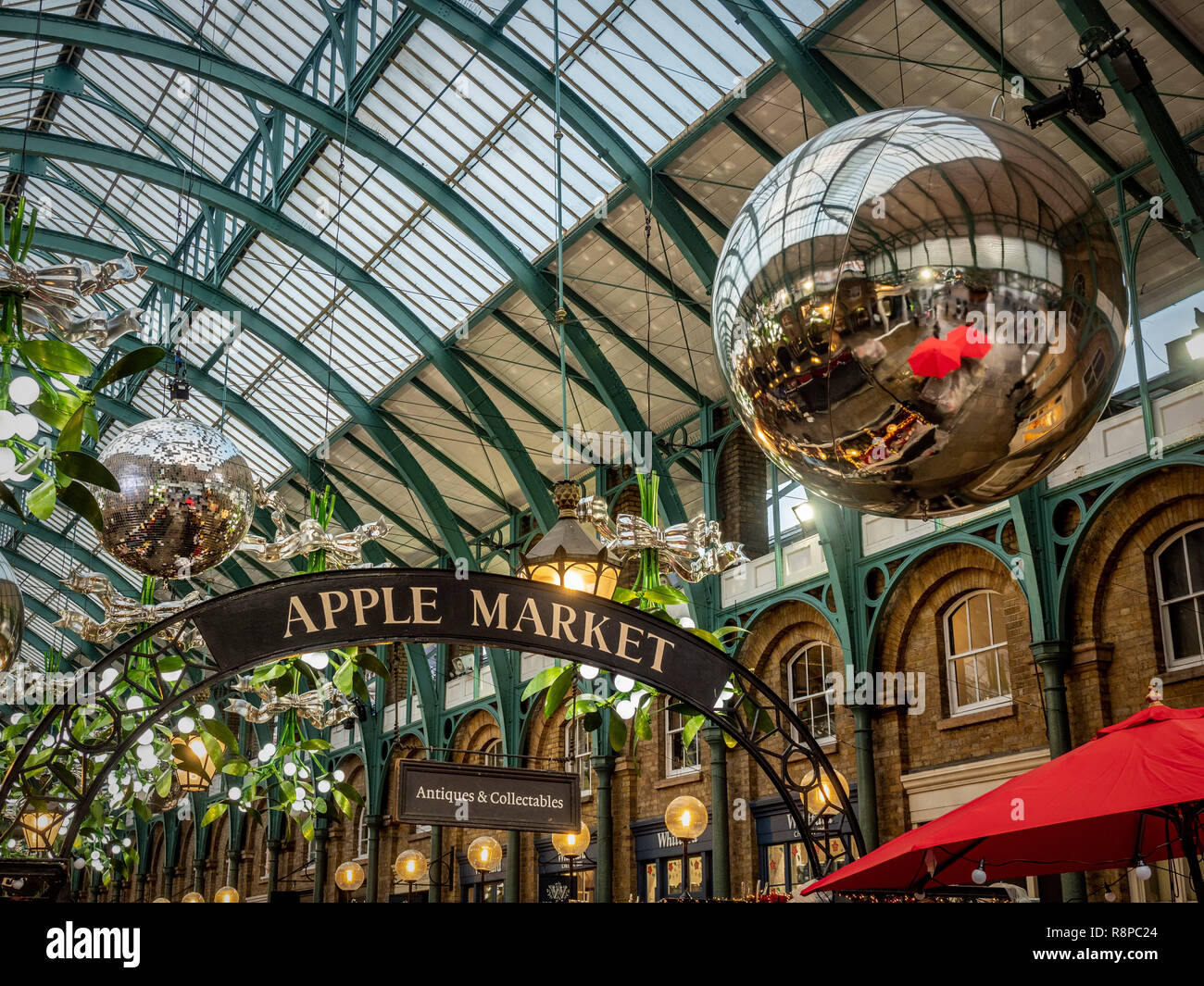 Apple market sign and Christmas decorations at Covent Garden, London ...