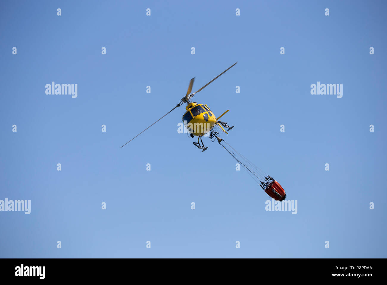 Firefighting helicopter in aerial exhibition Stock Photo - Alamy