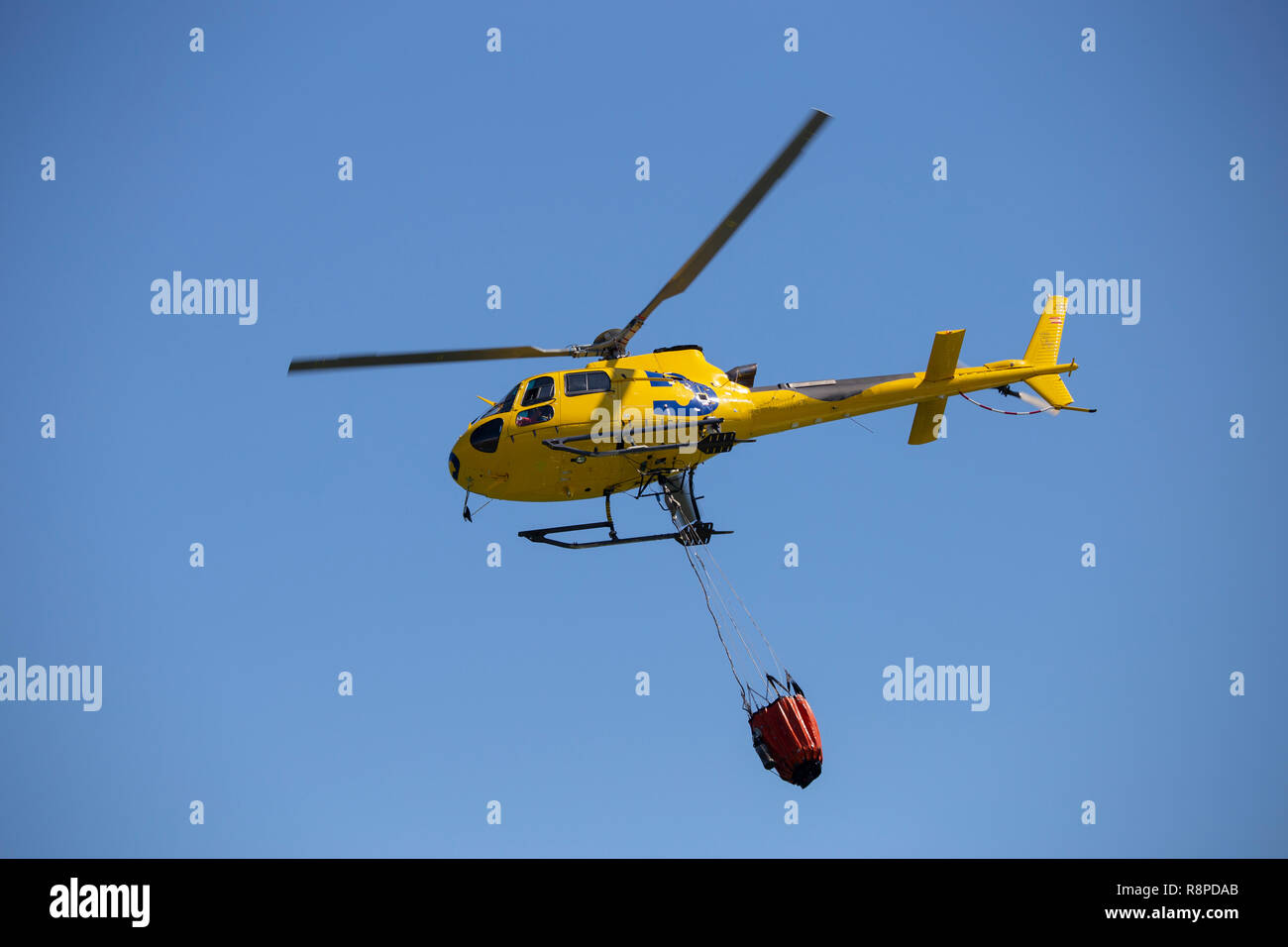 Firefighting helicopter in aerial exhibition Stock Photo - Alamy