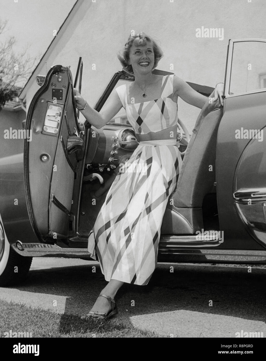 Doris Day, getting out of her Oldsmobile convertible, circa 1950 File ...
