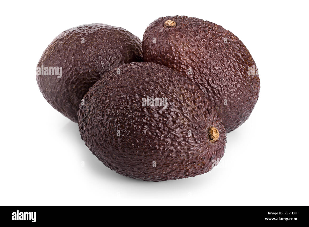 three whole avocado isolated on white background Stock Photo - Alamy