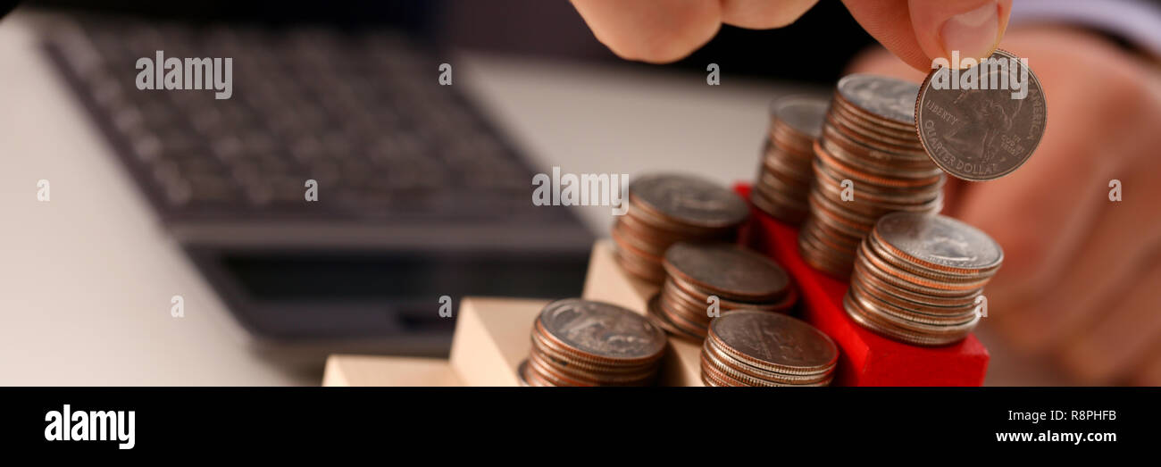 Hand businessman putting pin money Stock Photo - Alamy