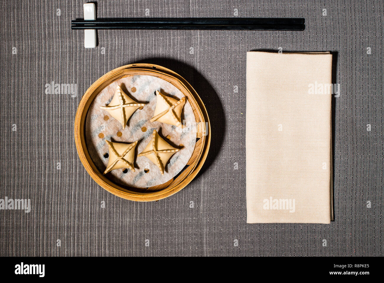 Chinese steamed ravioli filled with beef served in the typical bamboo ...