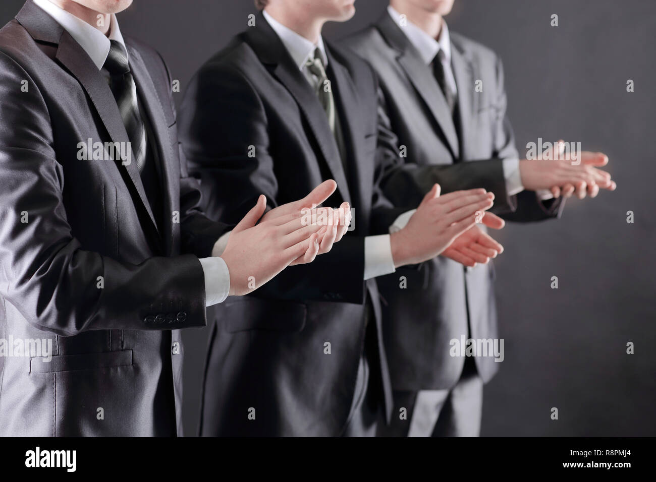 Applauding leadership smiling standing hi-res stock photography and ...