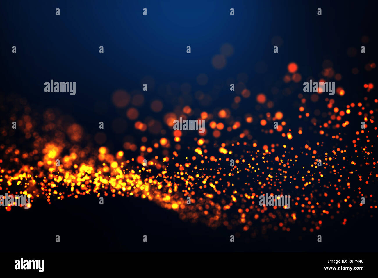 Golden fire particles trail wave blur on dark blue gradient background ...