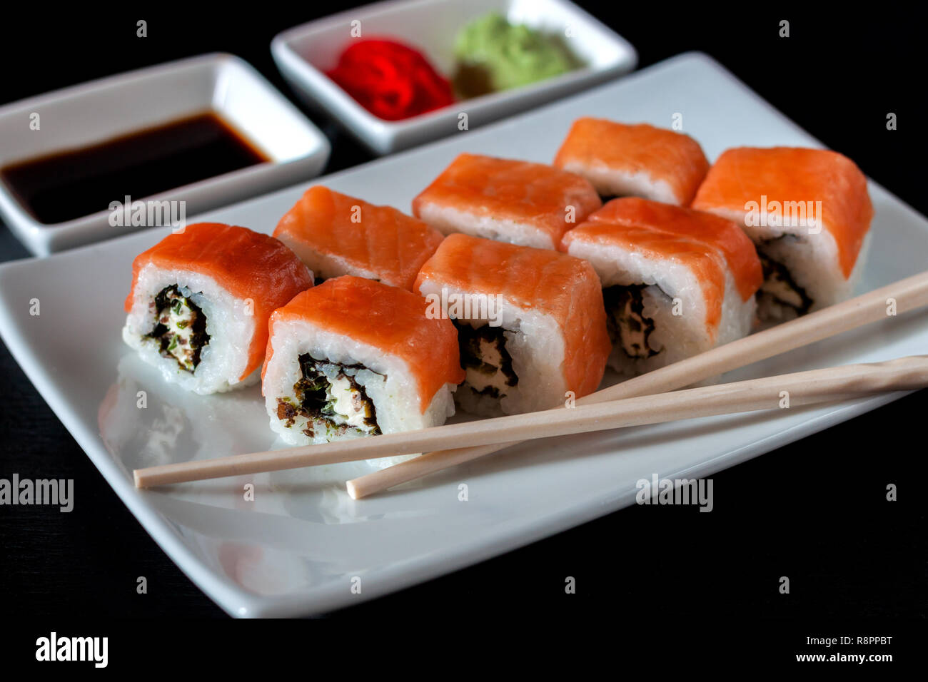 Philadelphia Sushi Roll made of Fresh Salmon, Avocado and Cream Cheese ...