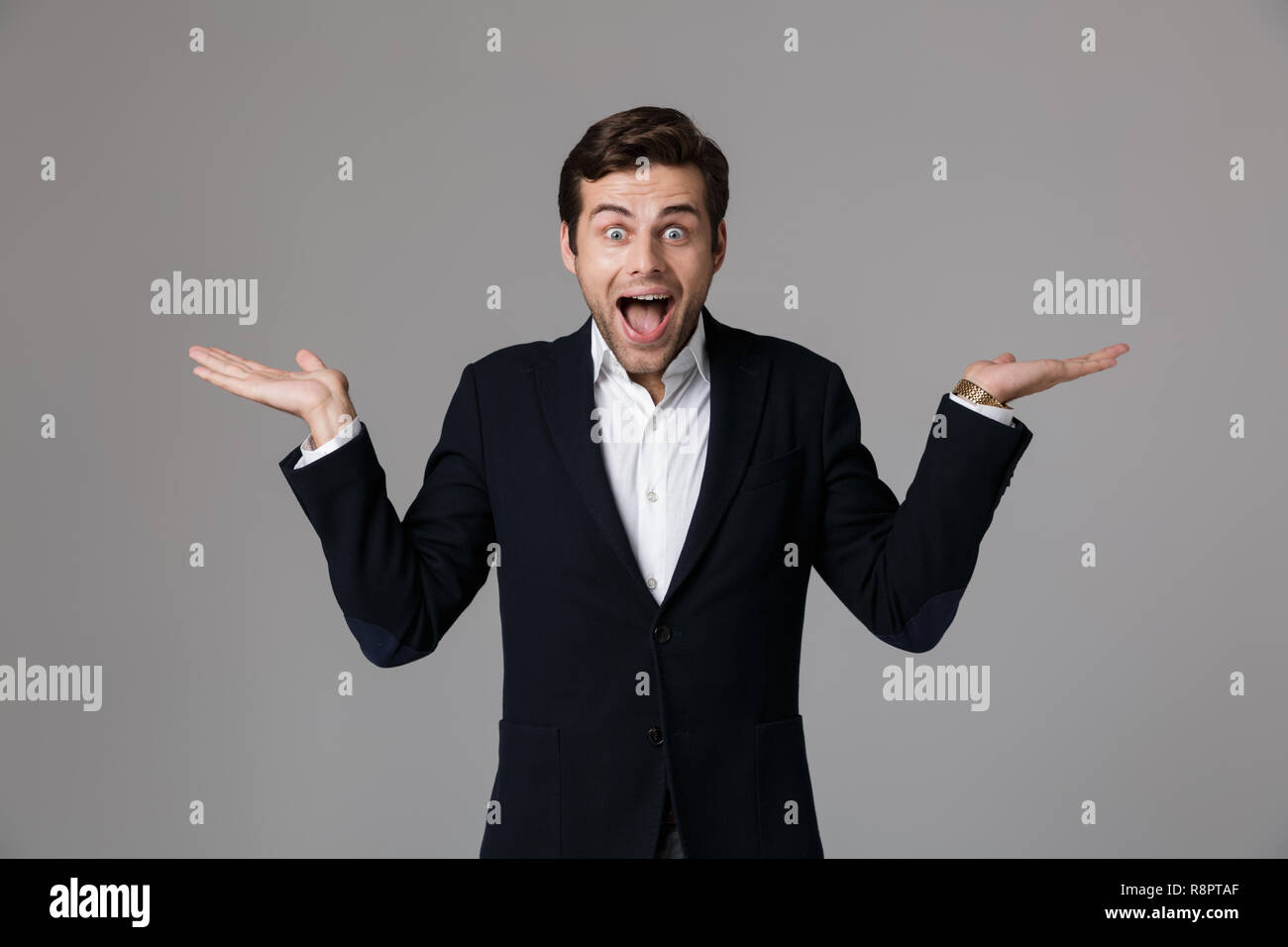 Image of european businessman 30s in formal suit screaming and throwing ...