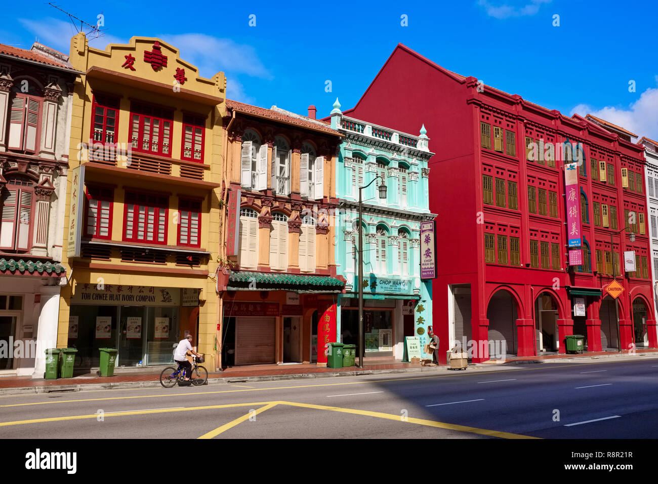 Colorful houses and a lone cyclist on a quiet Sunday morning, in Upper ...