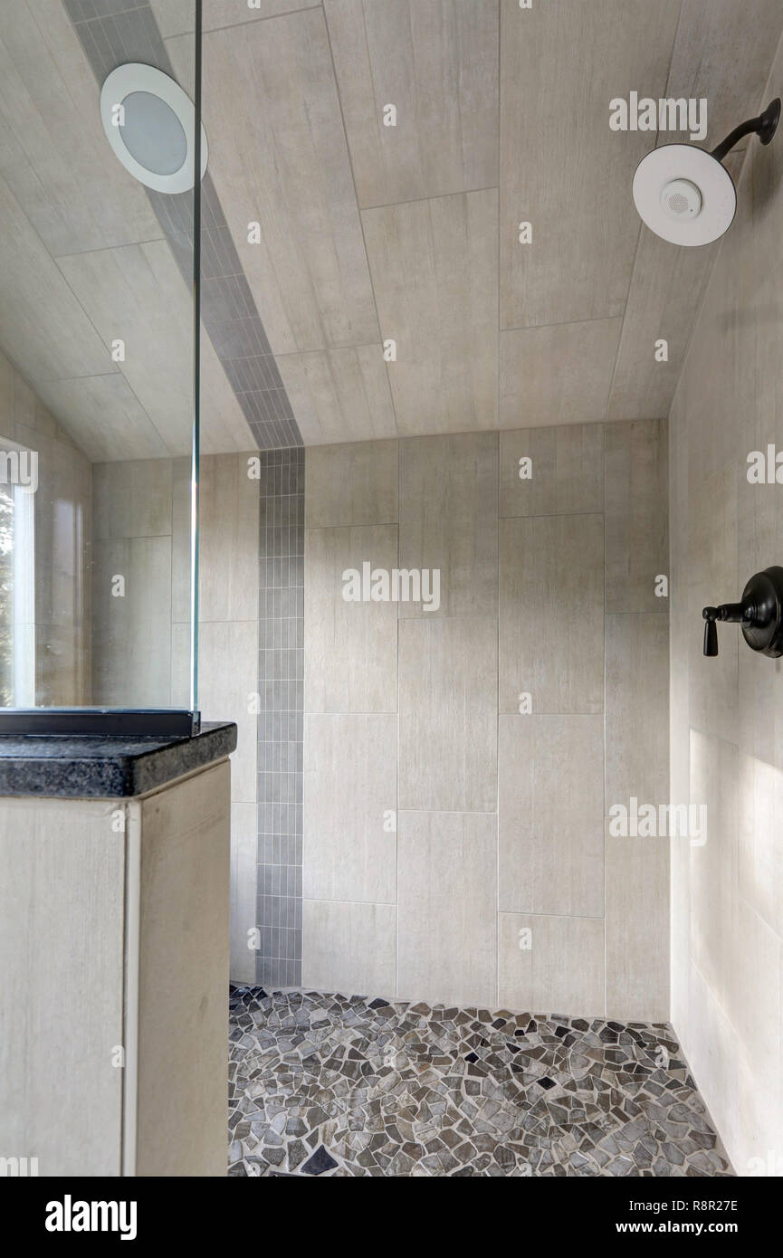 Country bathroom interior with vertical ivory subway tile shower ...