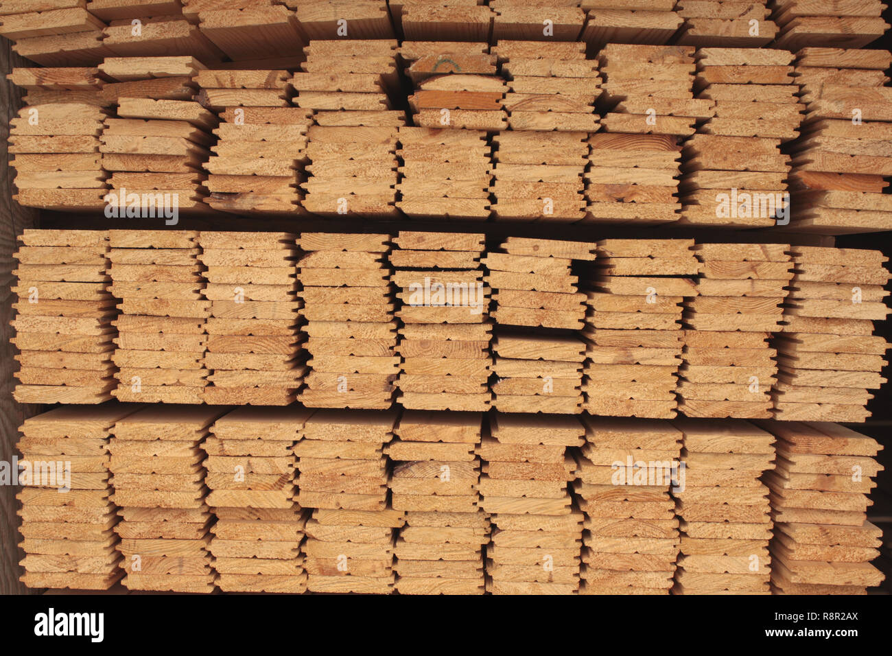 Row of boards in a building warehouse Stock Photo - Alamy