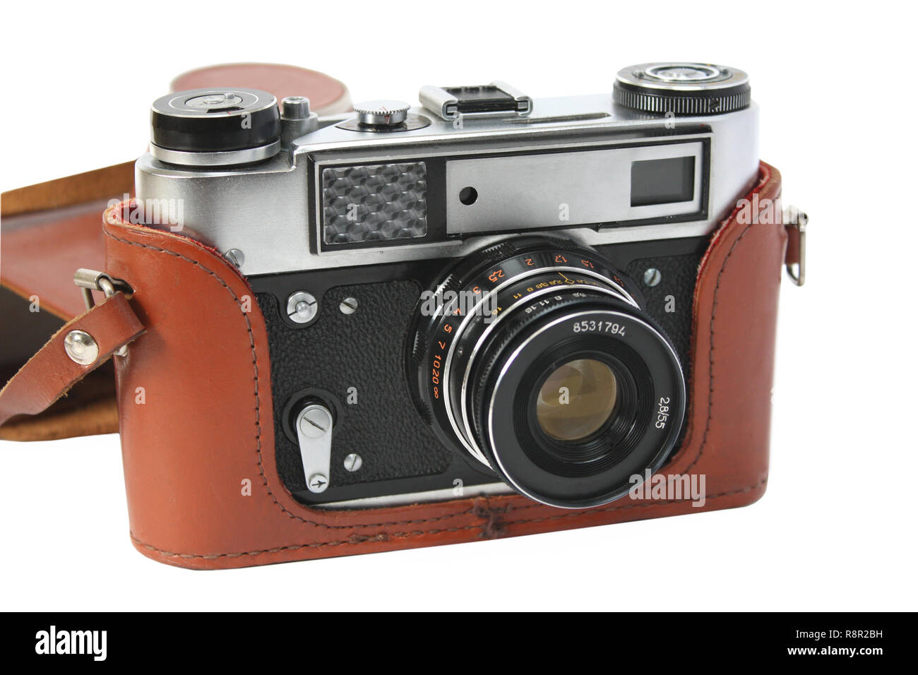 Retro photocamera in a leather case. Object over white Stock Photo - Alamy