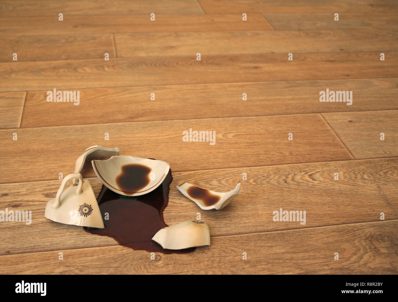 Coffee, flowed out from the broken cup Stock Photo - Alamy