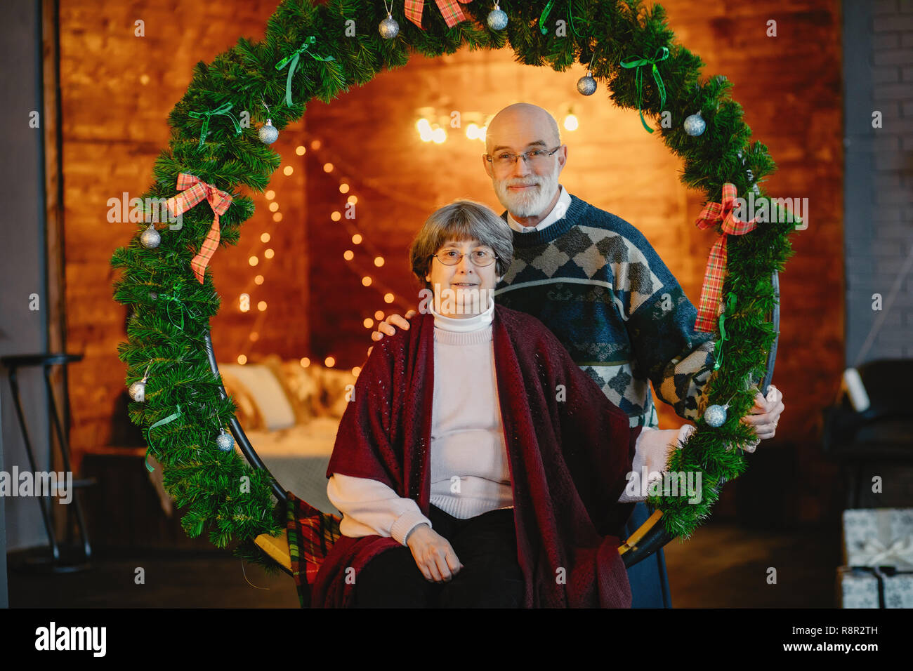An elegant old couple are celebrating Christmas Stock Photo - Alamy