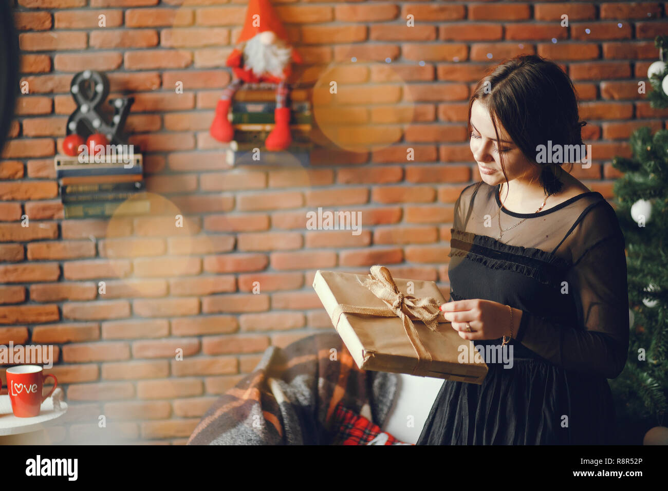 Lady with a present Stock Photo - Alamy