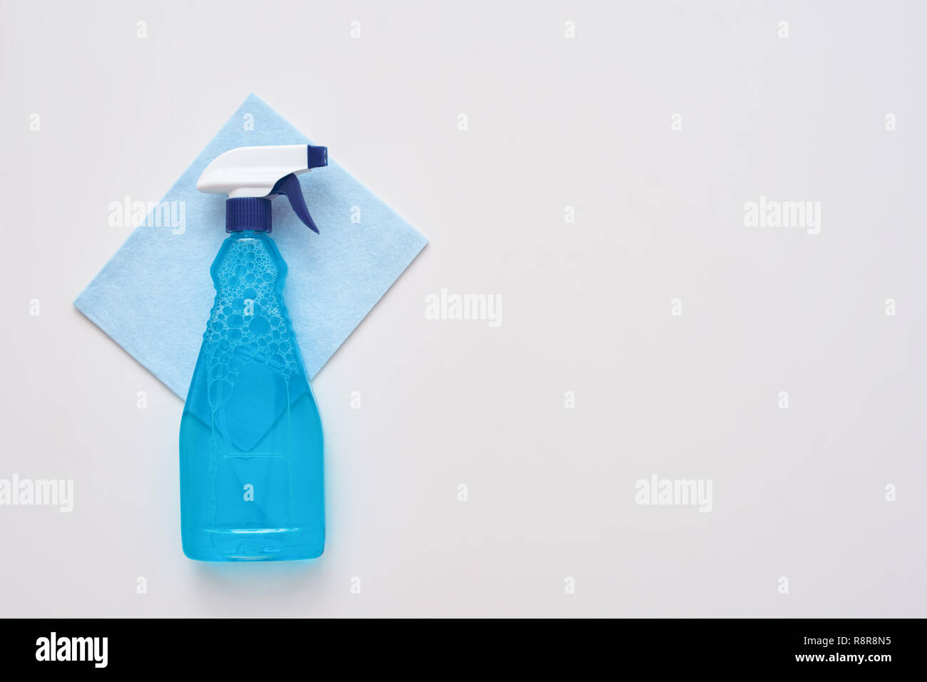 Cleaning tools. Spray bottle and blue cleaner cloth isolated Stock ...