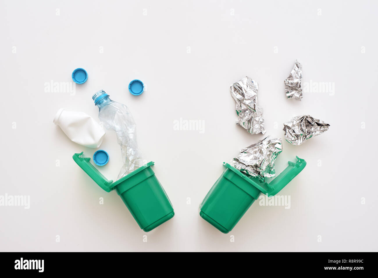 Foil and plastic. Crumple foil and plastic falling to the recycling bin ...
