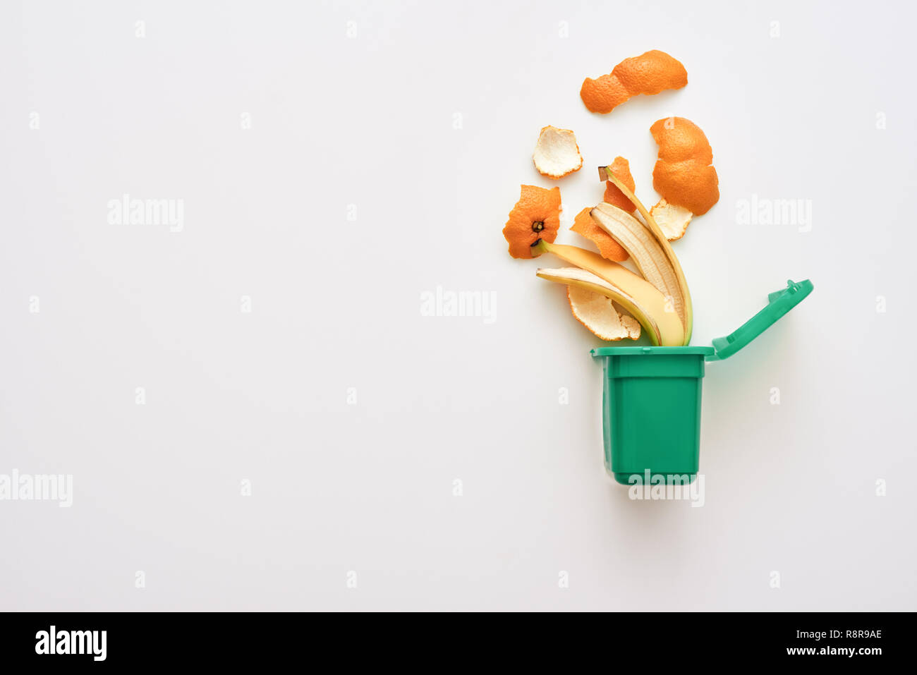 Organic garbage. Banana and orange peels, isolated Stock Photo - Alamy