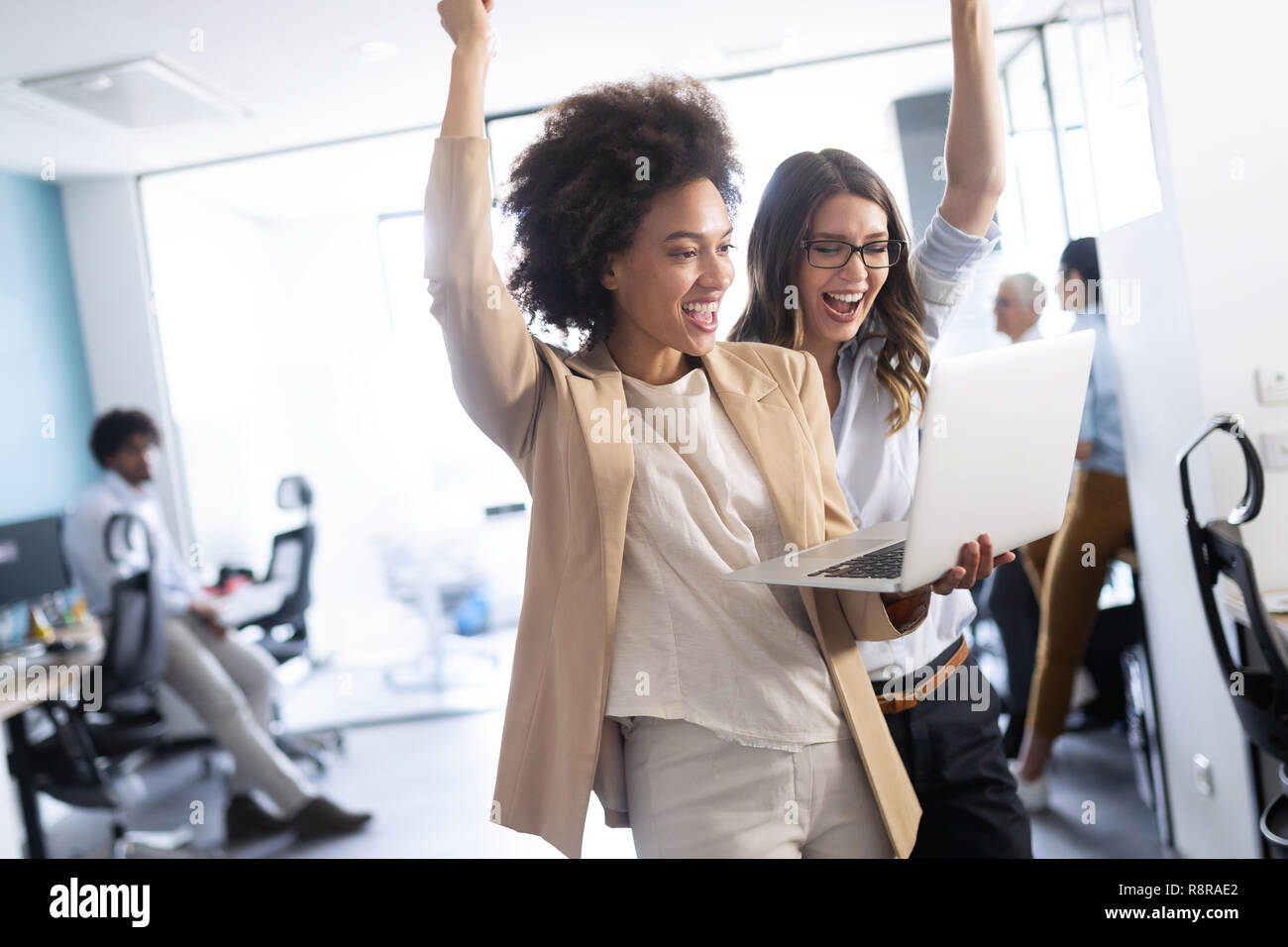 Business team celebrating a good job in the office Stock Photo - Alamy