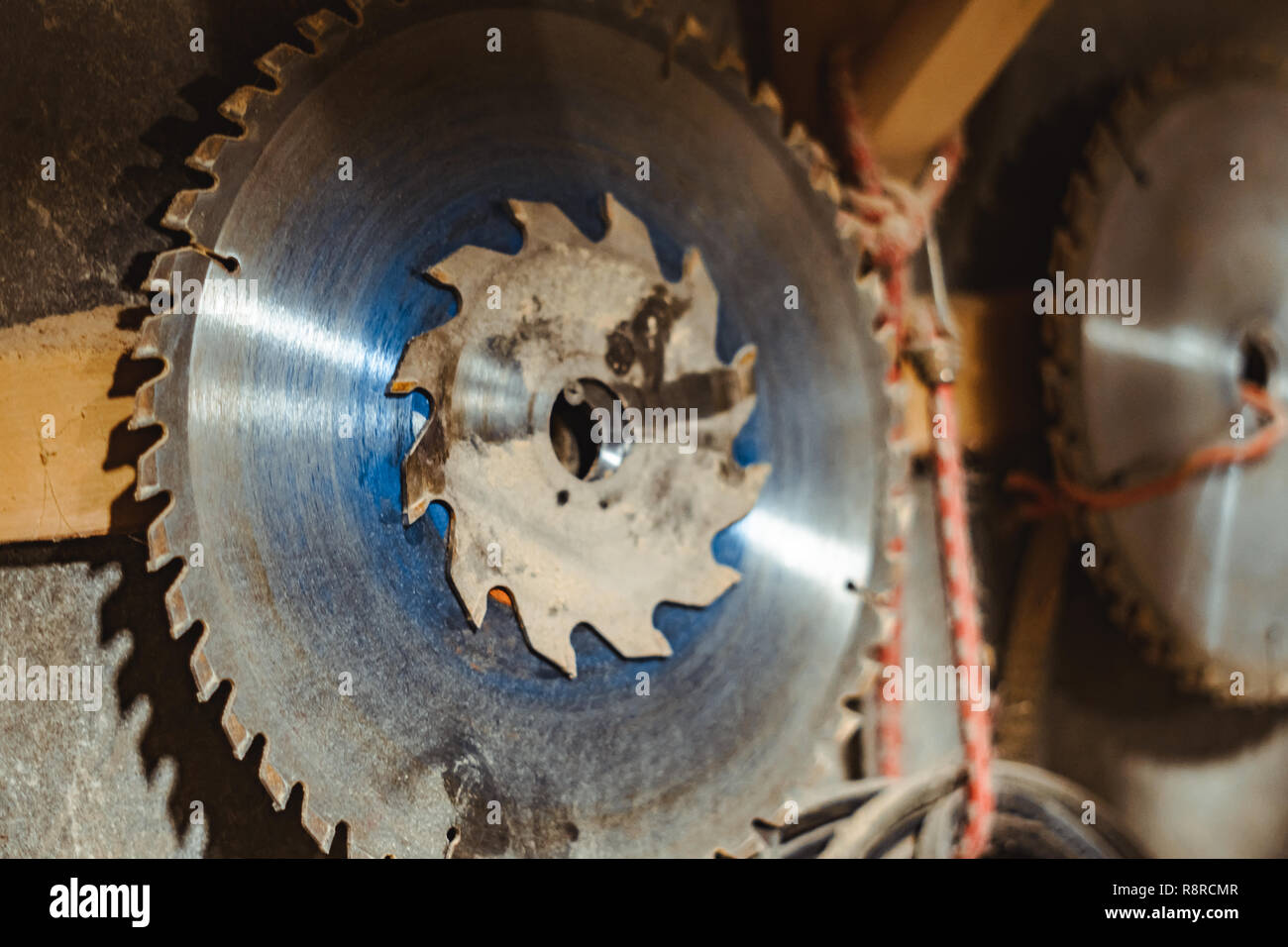 Old circular saw blade hanging on the wall Stock Photo - Alamy