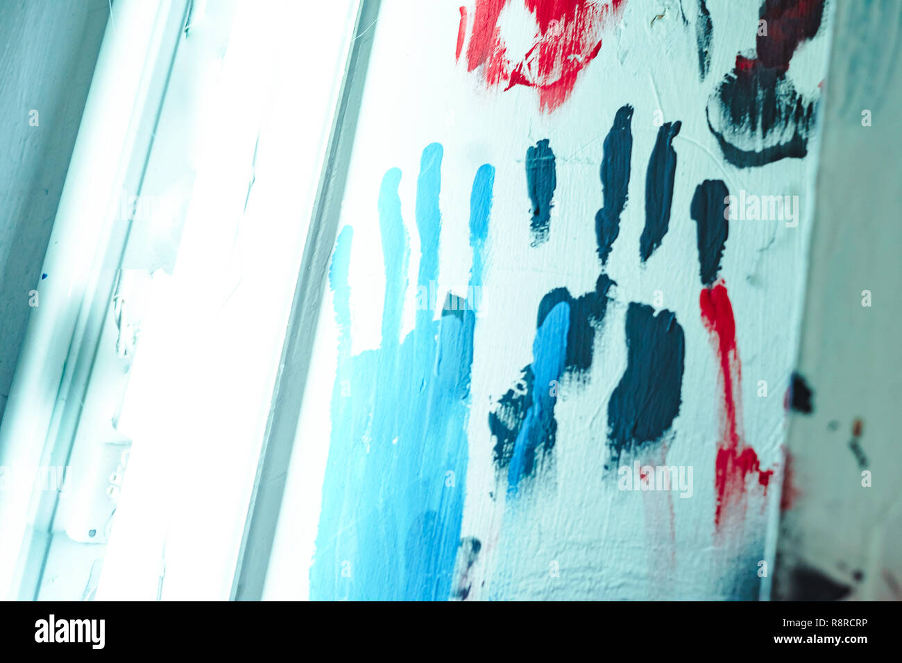handprint in paint on white wall Stock Photo - Alamy