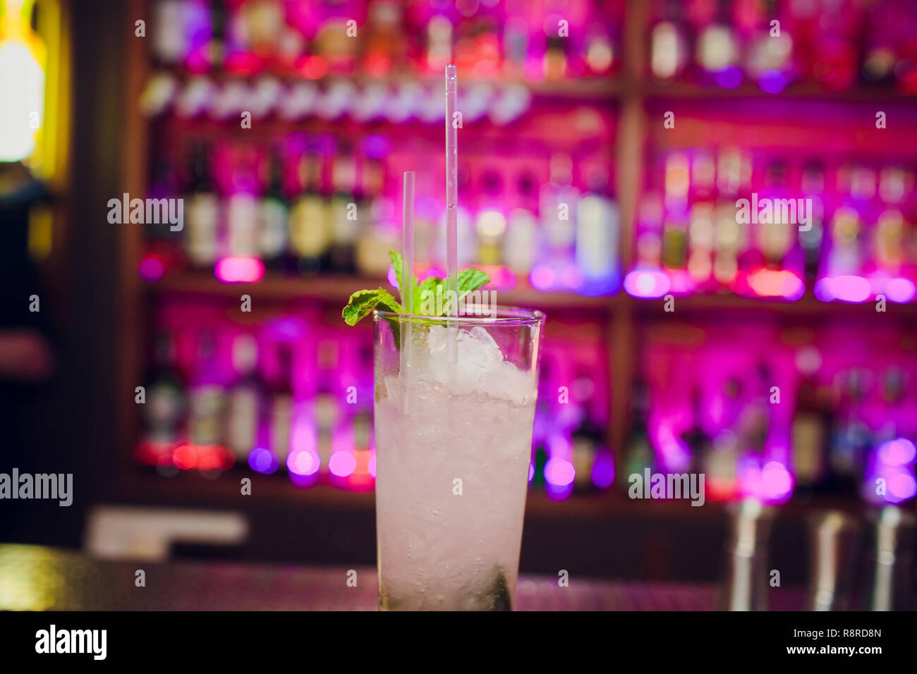 Glasses alcohol color cocktails on bar background Stock Photo - Alamy