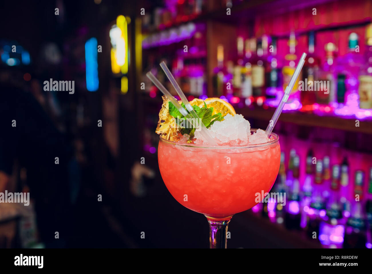 Glasses cocktails bar background Stock Photo - Alamy