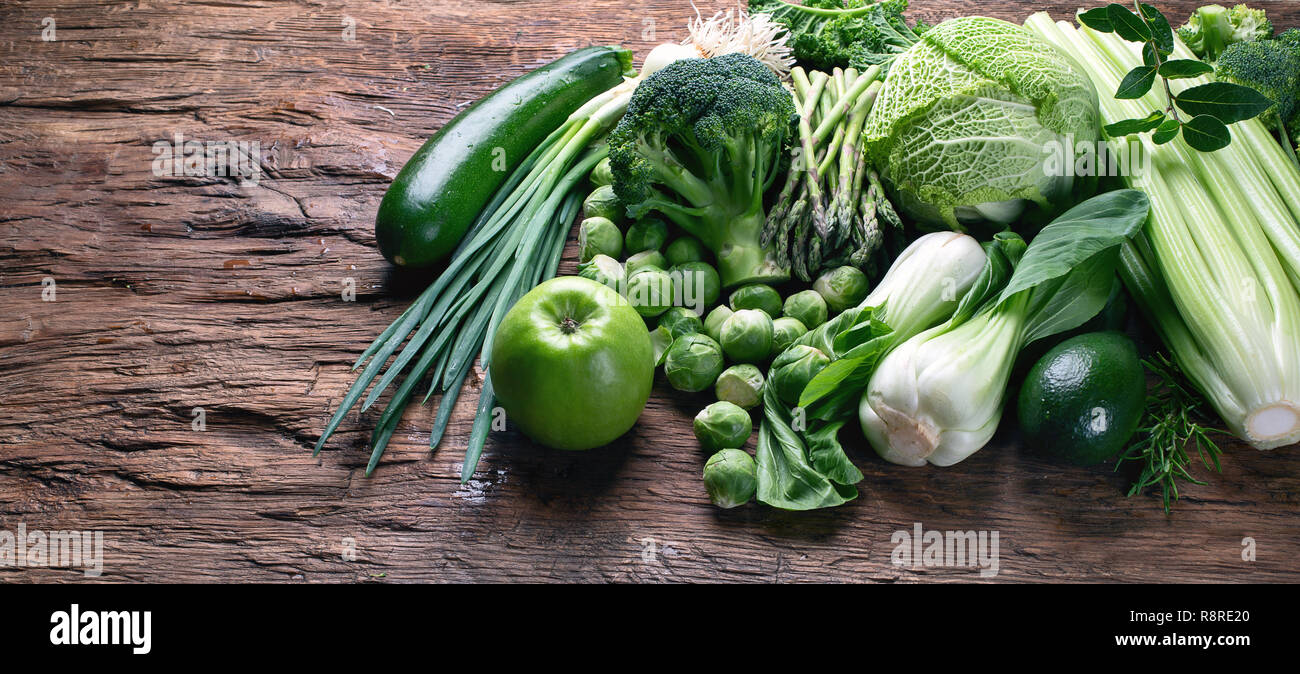 Fresh green vegetables on wooden table. Top view with copy space Stock ...