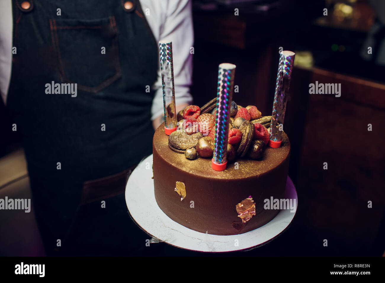 Birthday cake with fireworks on table Stock Photo - Alamy