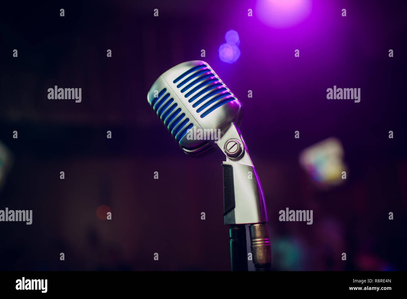 modern microphone for singing against beautiful blurry colored bokeh ...