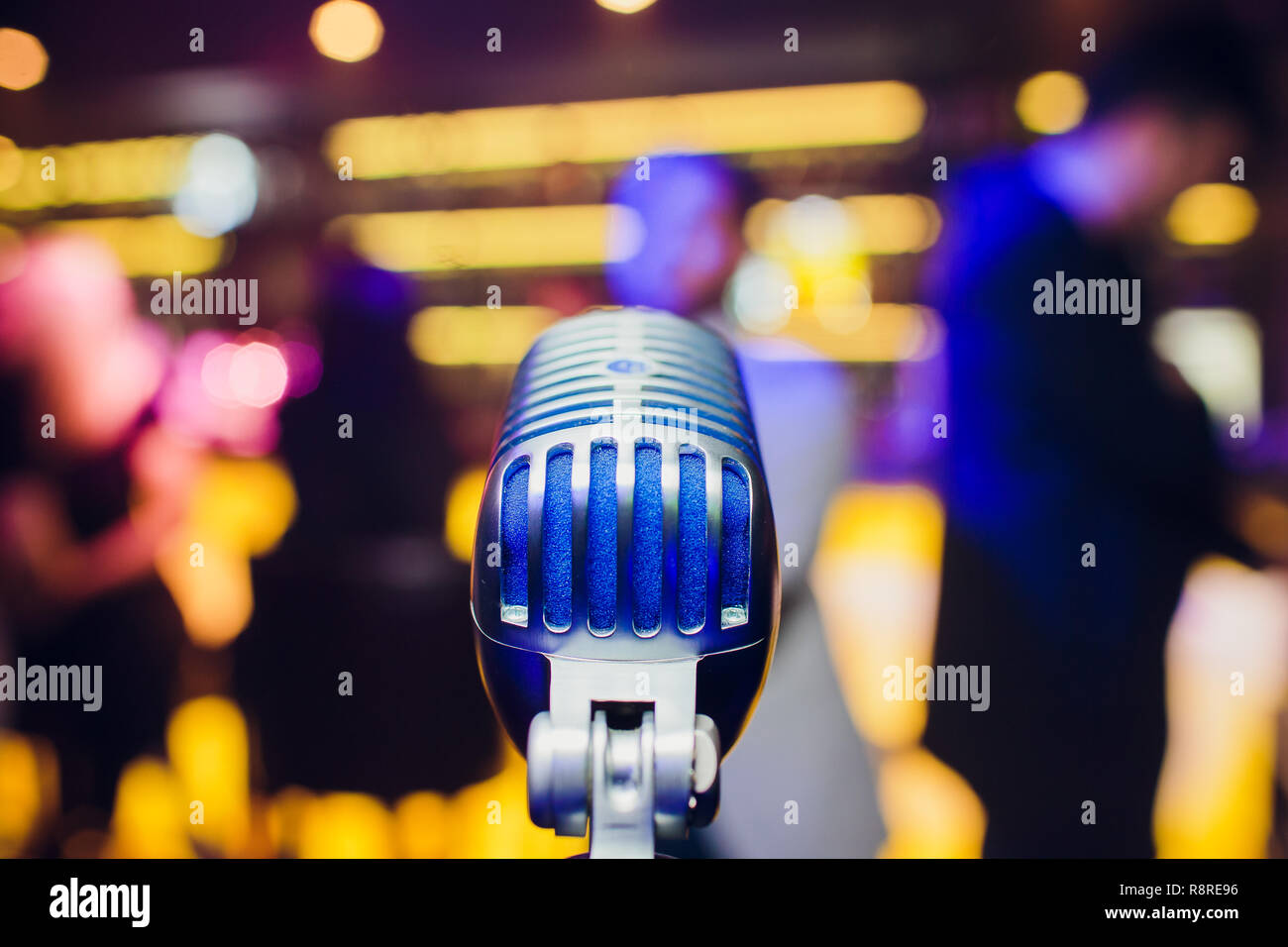 modern microphone for singing against beautiful blurry colored bokeh ...