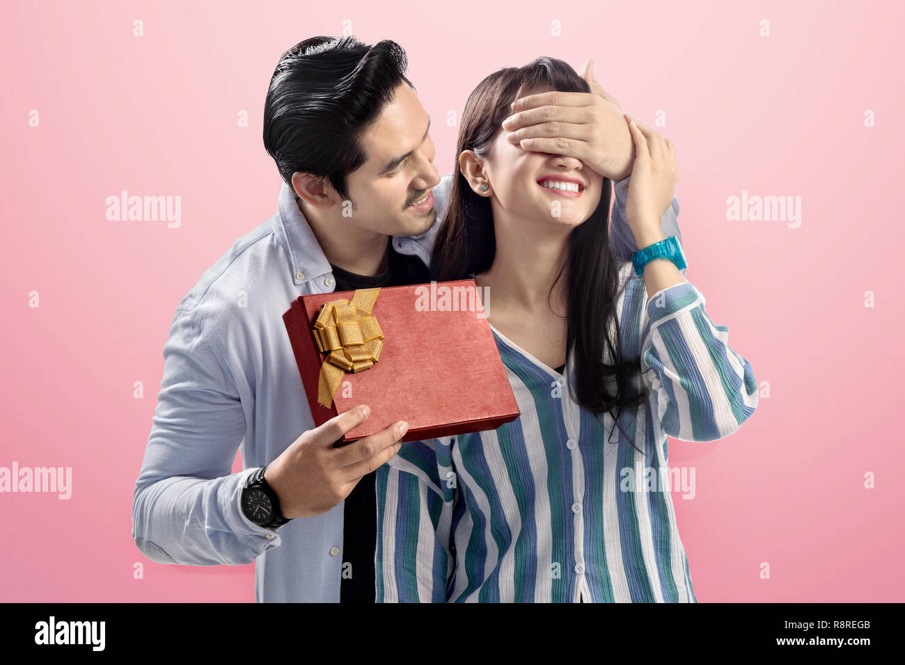 Boyfriend covering eyes girlfriend surprise hi-res stock photography ...
