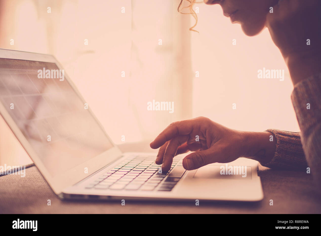 Woman looking out window filter hi-res stock photography and images - Alamy