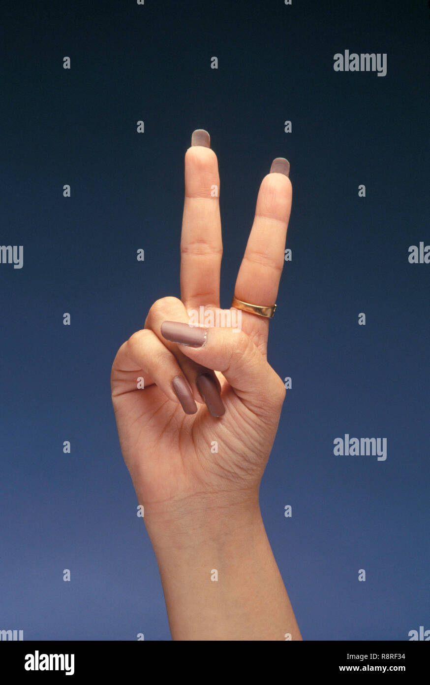 Hand showing two fingers Stock Photo - Alamy