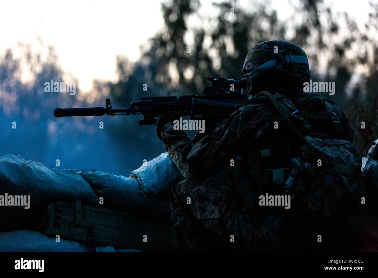 Sniper armed with large caliber, sniper rifle, shooting enemy targets ...