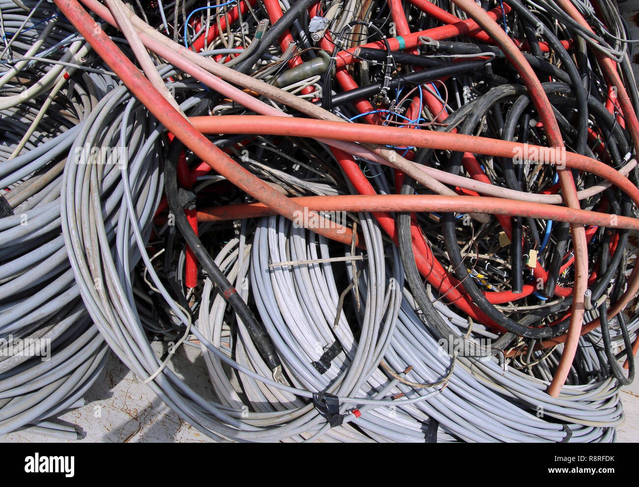 colored electric cables in a container of a landfill Stock Photo - Alamy