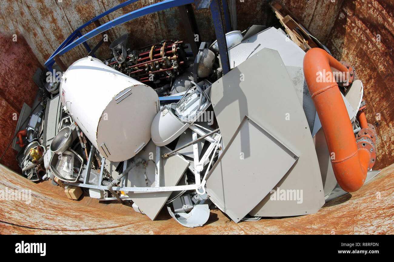 container with many pieces of iron and metal material for recycling ...