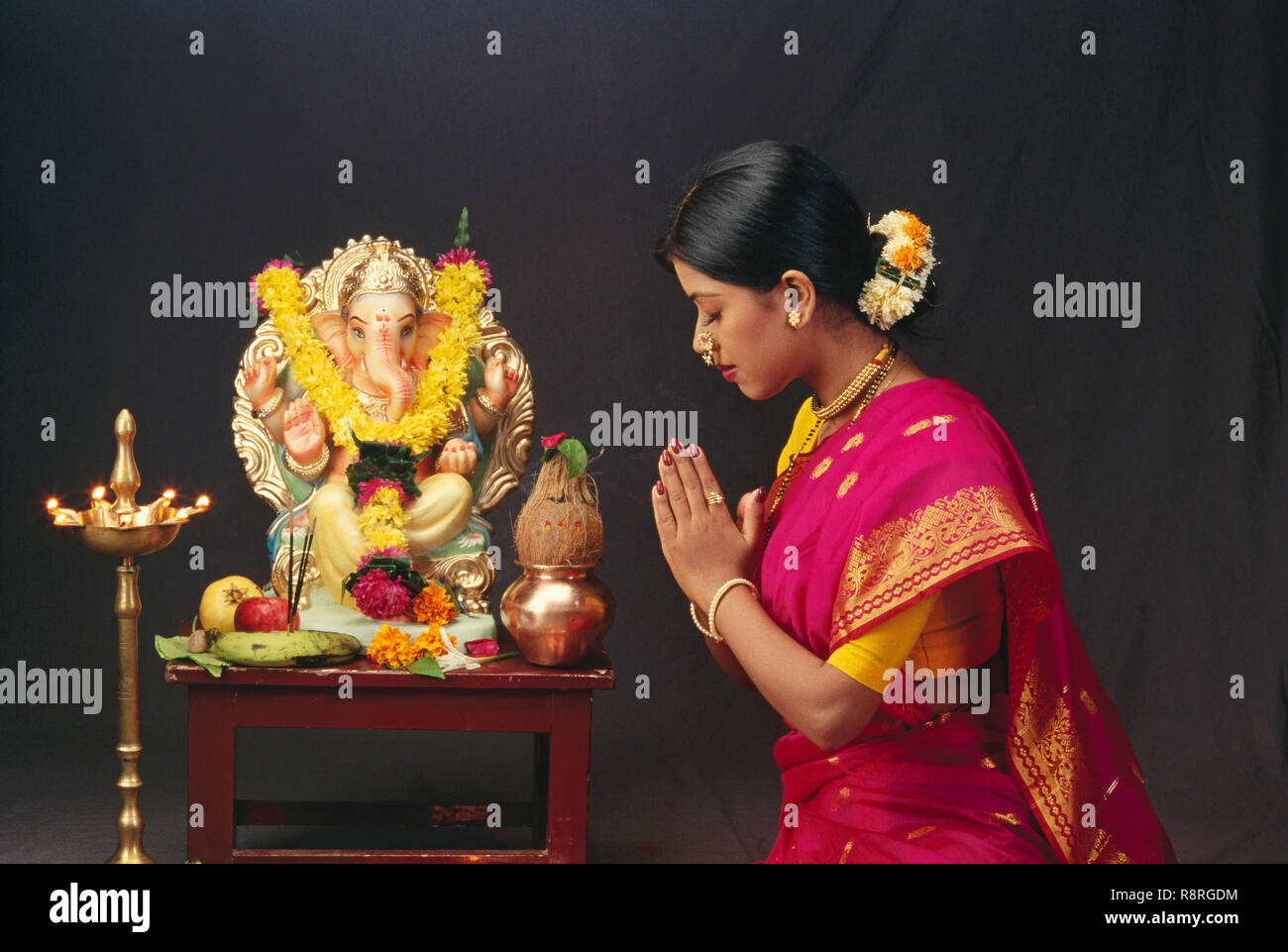 Woman Worshiping idol of Elephant headed God Ganesh ganpati Festival MR ...