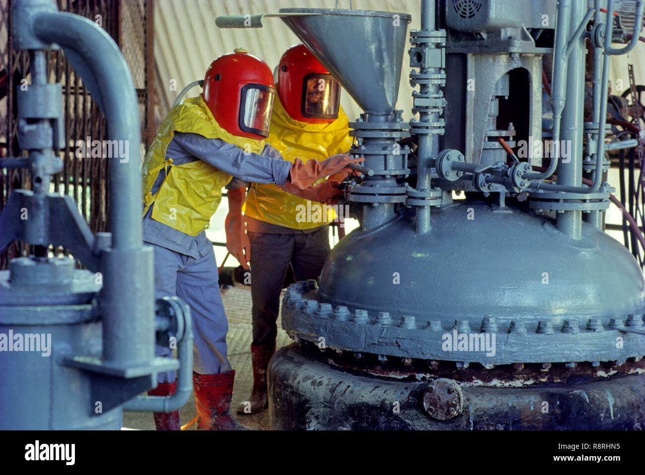 Men wearing safety mask dress in chemical plant Stock Photo - Alamy